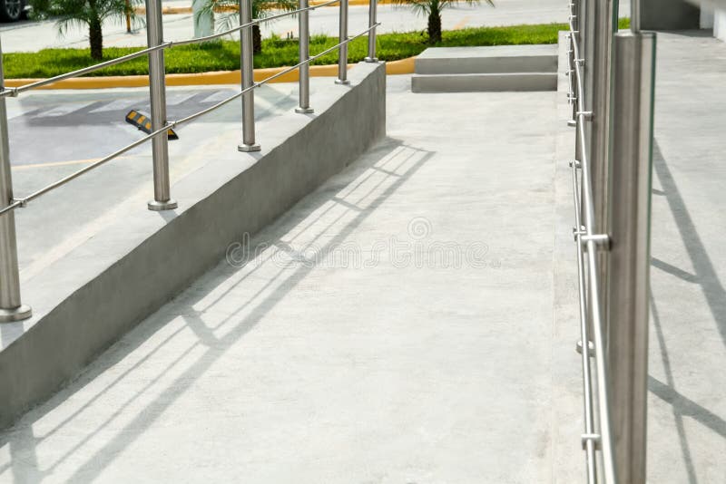 Concrete Ramp with Shiny Metal Railings Outdoors Stock Photo - Image of ...