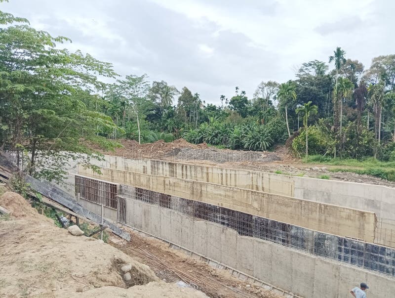 Concrete Retaining Wall Construction Site with Trees and Dirt Stock Photo - Image of clouds ...