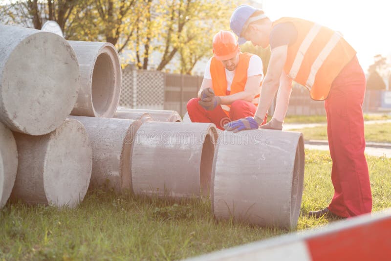 Concrete Rings on the Construction Site Stock Photo - Image of clothes ...