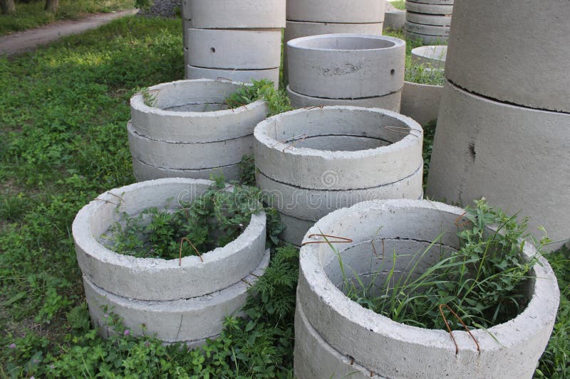 Concrete Rings Stacked on Grassy Surface Stock Image - Image of lawn ...