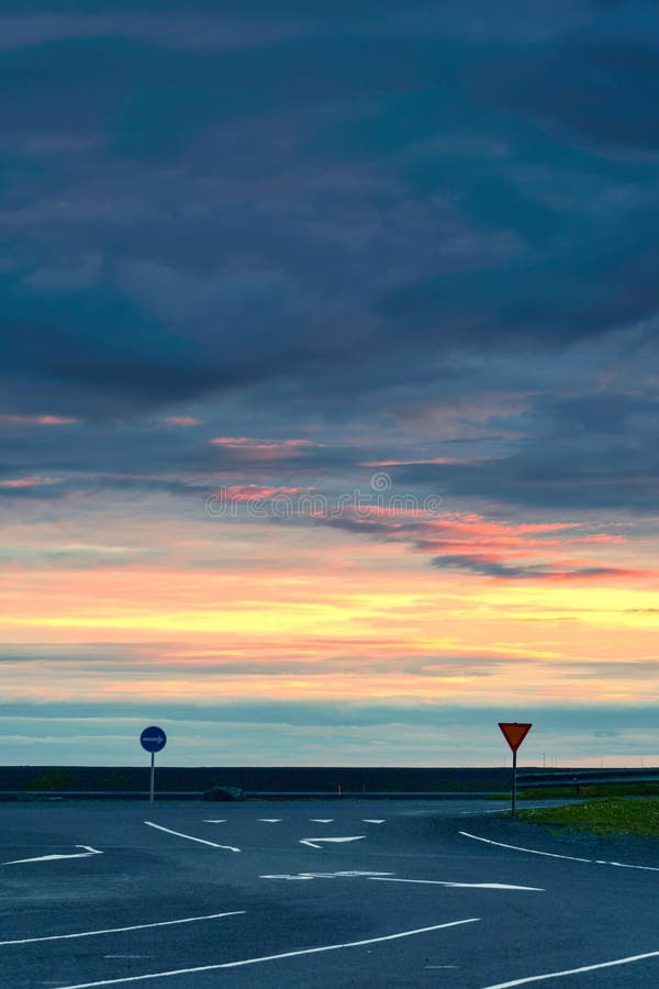 Concrete Road with Traffic Signs and Colorful Sky Stock Image - Image ...