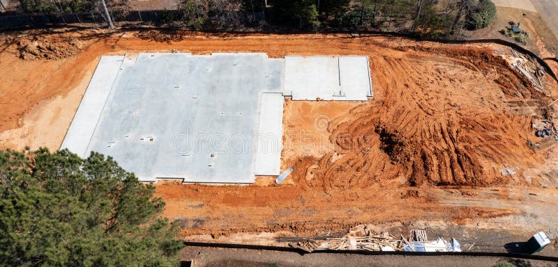 Concrete slab on dirt lot stock photo. Image of development - 240378810