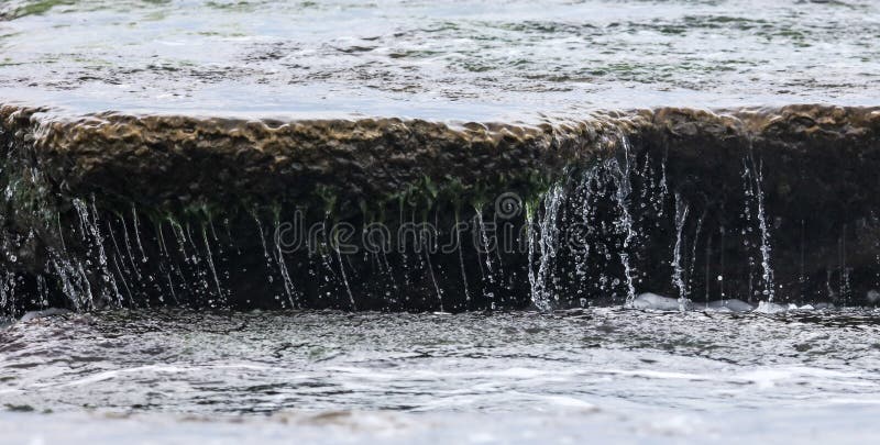 Concrete Slab in a Spray of Water in the Sea Stock Image - Image of ...