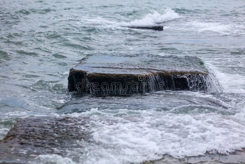 Concrete Slab in a Spray of Water in the Sea Stock Photo - Image of ...