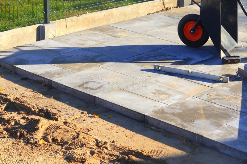 Concrete Slabs. Paving Tools, Wheelbarrows, Shovels, Spirit Level ...