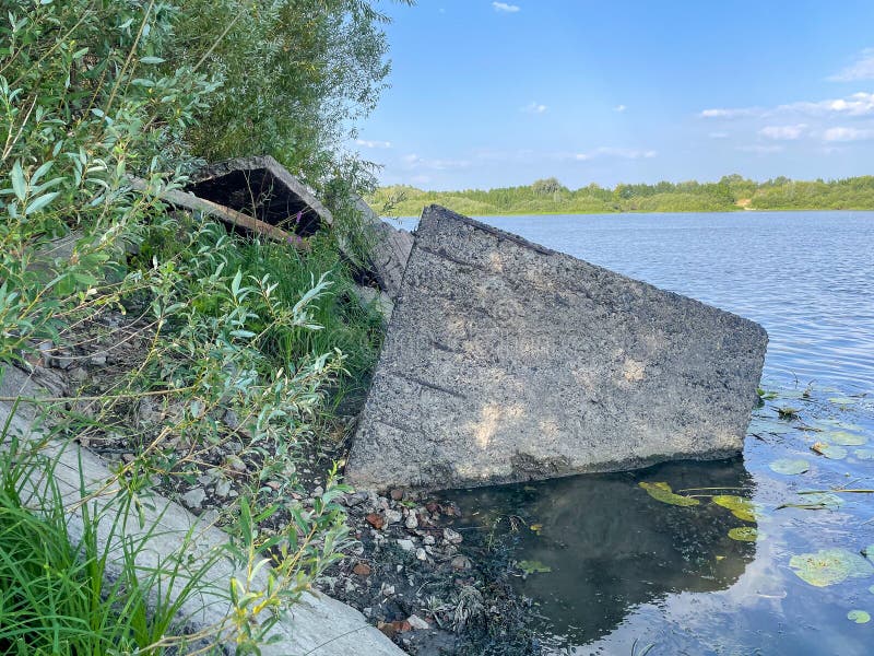 Concrete Structure in the Water Near the River Bank in Summer Stock ...