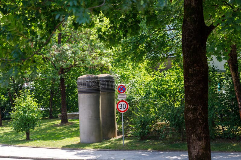 Concrete Structures and Traffic Signs by Sidewalk and Greenery Stock ...