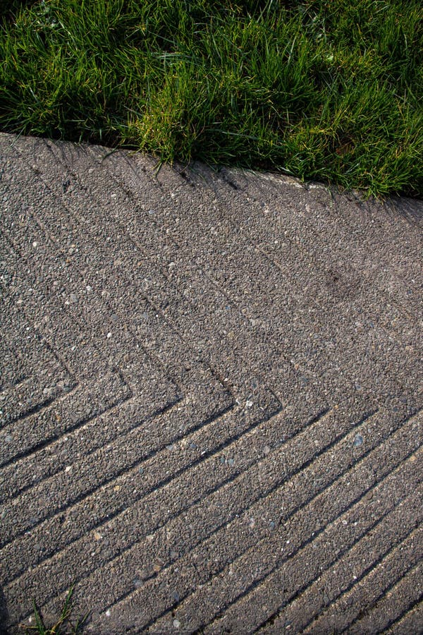 A Concrete Textured Sidewalk Path with a Check Mark Pattern on the ...