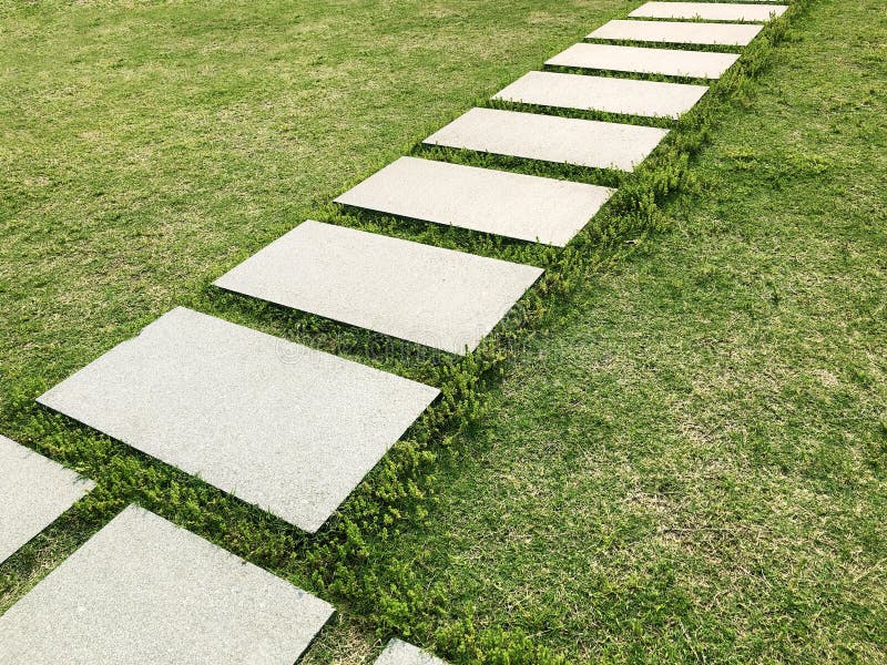 Concrete Tiles on Grass stock image. Image of brick - 116022197