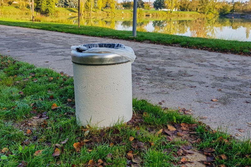 Concrete Trash Can on the Path by the Lake Stock Photo - Image of ...