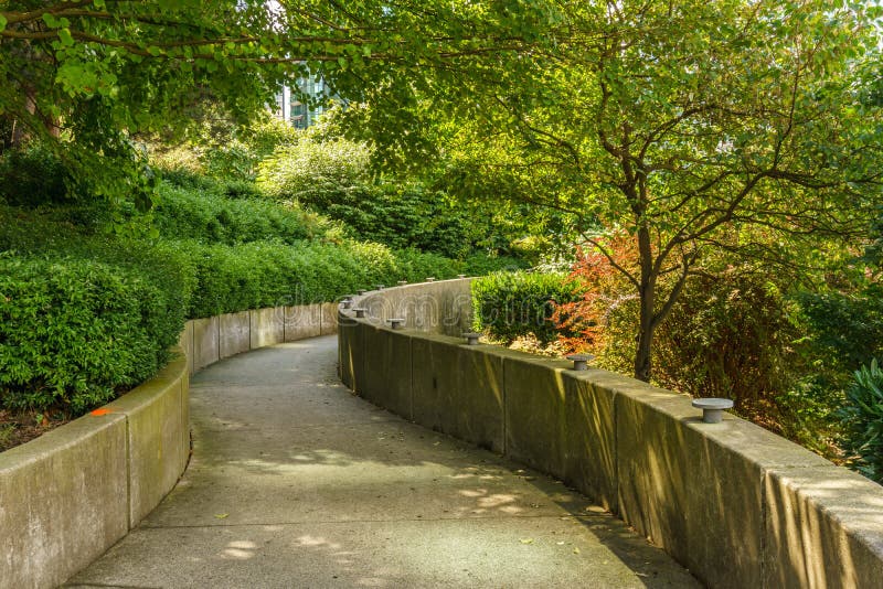 Concrete Walk Path in the Green City Park Background. Stock Photo ...