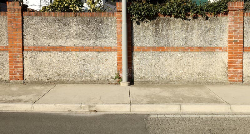 Concrete Wall with Columns and Horizontal Stripes Made of Bricks ...