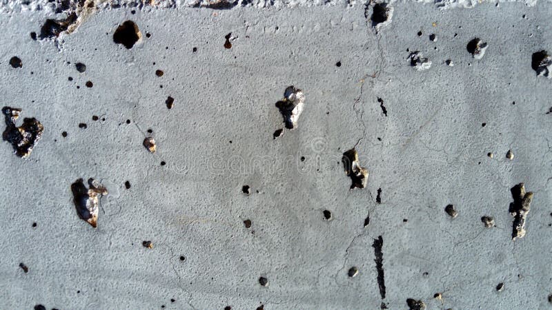 Concrete Wall with Concentric Damage of Large Radius. Potholes ...