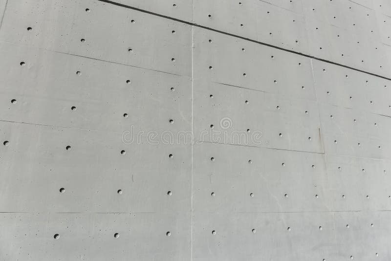 Concrete wall with holes stock photo. Image of pattern - 48462402
