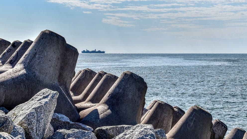 Concrete Wave Breakers in a Calm Sea Stock Photo - Image of horizon ...