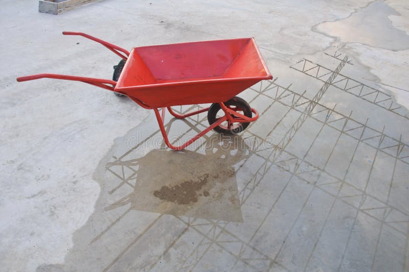 Concrete wheel barrow stock photo. Image of site, water - 24511884