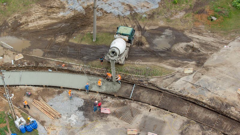 Concrete Works for Road Construction with Many Workers and Mixer ...