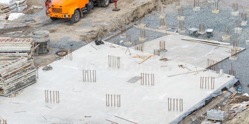 Concreting Work: Construction Site Worker during Concrete Pouring into ...
