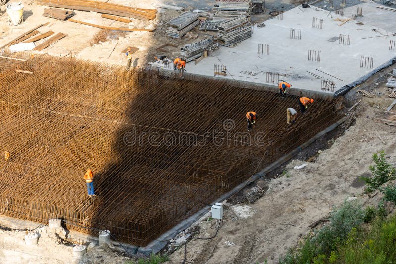 Concreting Work: Construction Site Worker during Concrete Pouring into ...