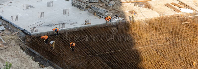 Concreting Work: Construction Site Worker during Concrete Pouring into ...