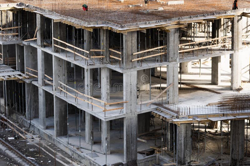Concreting Work: Construction Site Worker during Concrete Pouring into ...