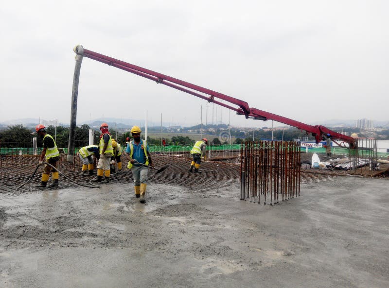 Concreting Work by Construction Workers at the Construction Site ...