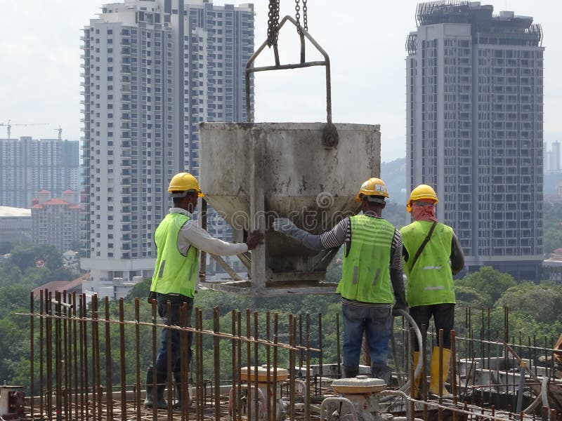 Concreting Work by Construction Workers at the Construction Site ...