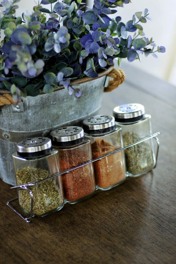 Condiment Set with a Vase of Flowers on the Table Stock Image - Image ...