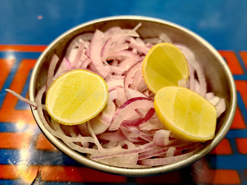 Condiments for Indian Dinner, Fresh Onions and Lemons. Stock Image ...