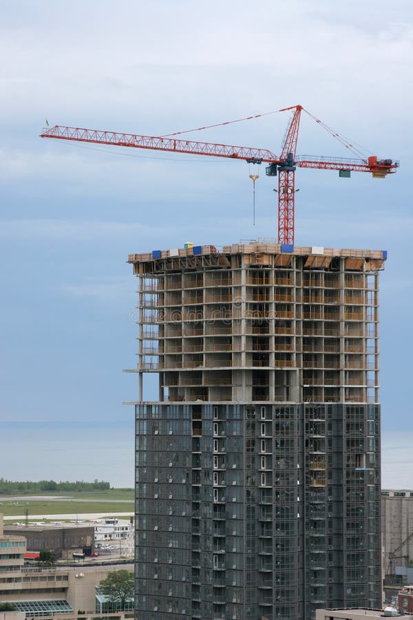 Condo Under Construction stock photo. Image of crane - 18030550