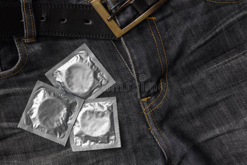 Condoms on jeans pocket. stock image. Image of jeans - 92394703