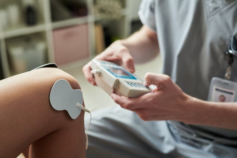 Conducting Electrical Stimulation Therapy in Medical Setting Stock ...