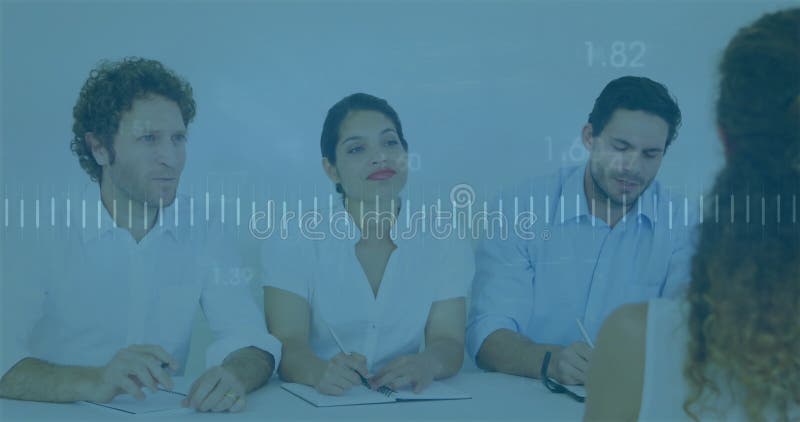 Conducting Interview Panel Taking Notes at Meeting Table, with ...