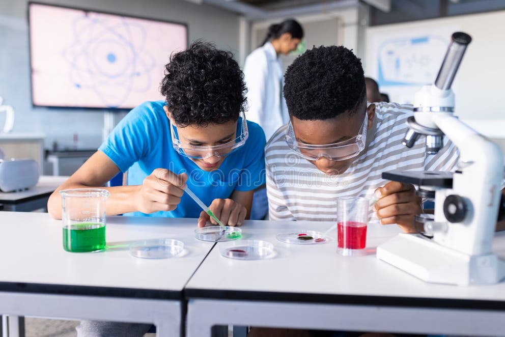 Conducting Science Experiment with Beakers and Microscope, Students in ...
