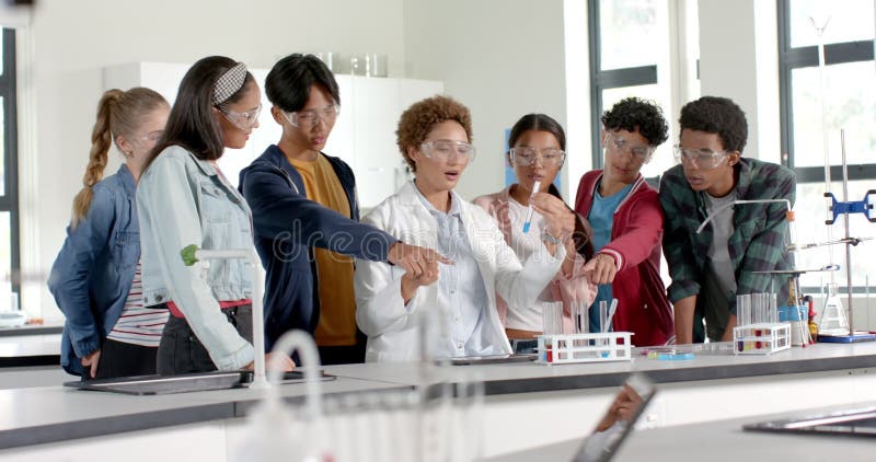 Conducting Science Experiment in High School Laboratory, Students ...