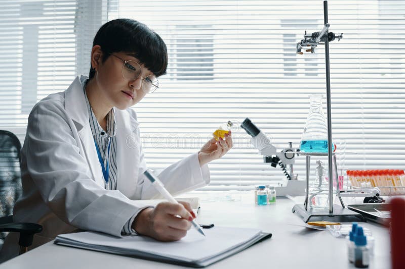 Conducting Science Experiment in Laboratory Setting Stock Image - Image ...
