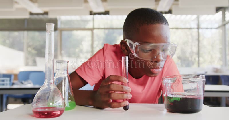 Conducting Science Experiment with Test Tubes and Beakers, Boy in ...