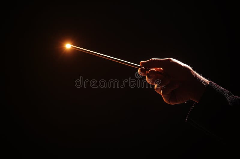 A Conductor Hand Holding Baton in Concert. Stock Photo - Image of stage ...