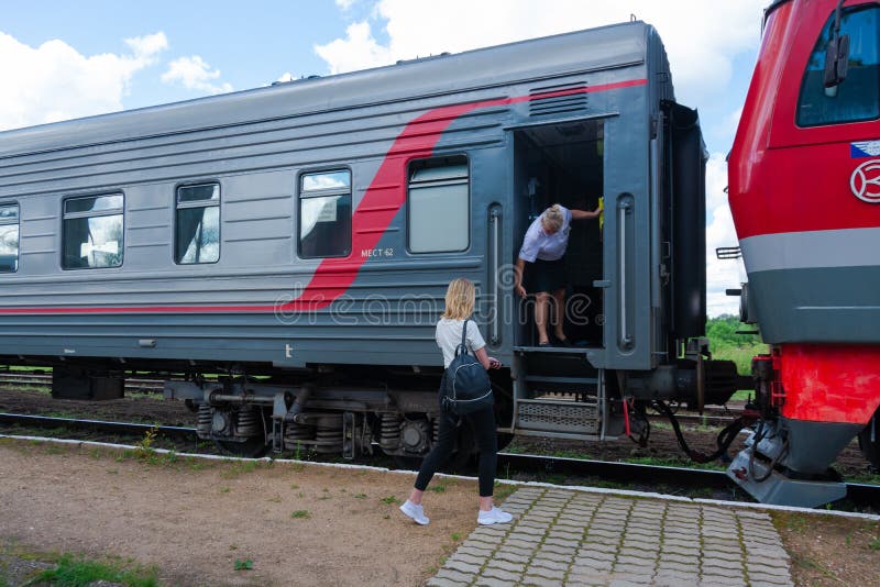 The Conductor Raises the Folding Platform in the Vestibule of the ...