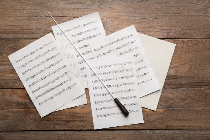 Conductor`s Baton and Sheet Music on Wooden Table, Flat Lay Stock Image ...