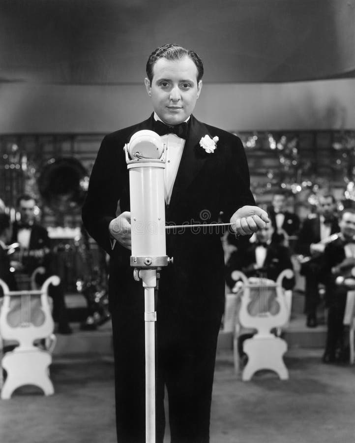 Conductor Standing in Front of His Orchestra with a Baton Stock Image ...