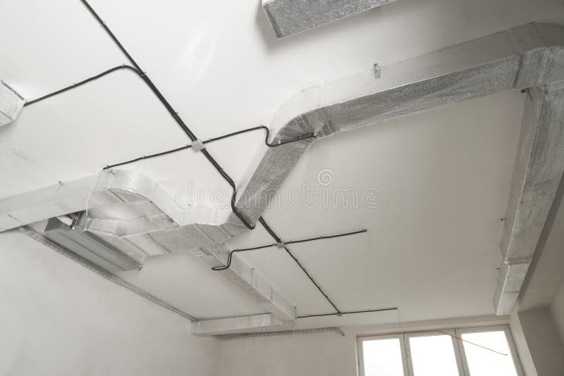 Conduits with Cables and Ventilation System on White Ceiling, Low Angle ...