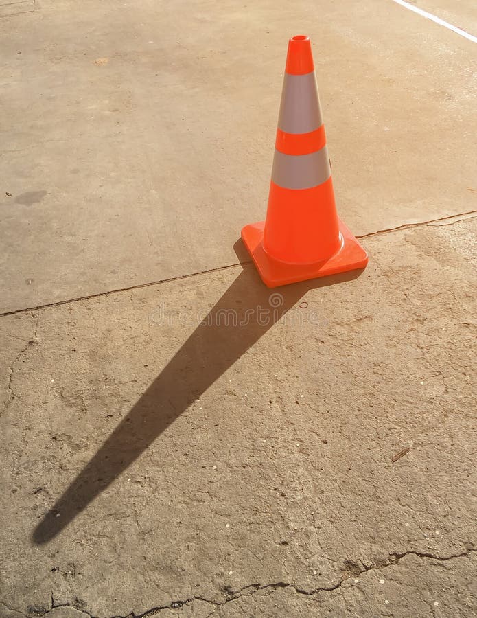 Cone on the cement road stock image. Image of concrete - 141517221