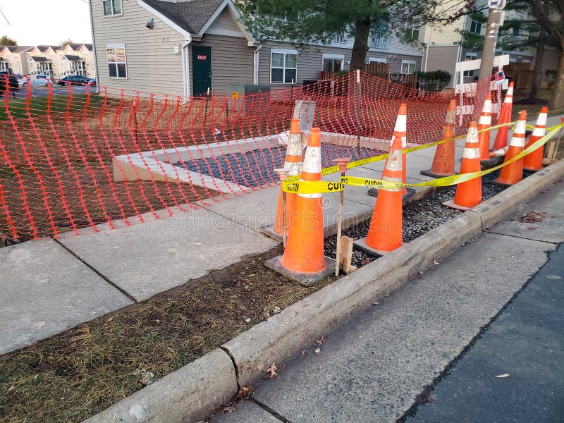 Cone and Mesh Fencing on the Sidewalk. Construction of Bus Stop and ...