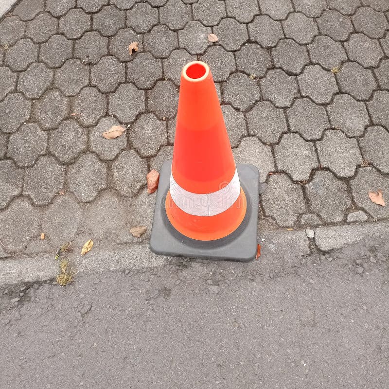 Cone on paving blocks stock photo. Image of pink, pattern - 243356314