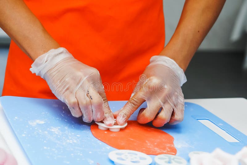 Confectioner on a Blue Board Makes Cookies from Forms Stock Image ...