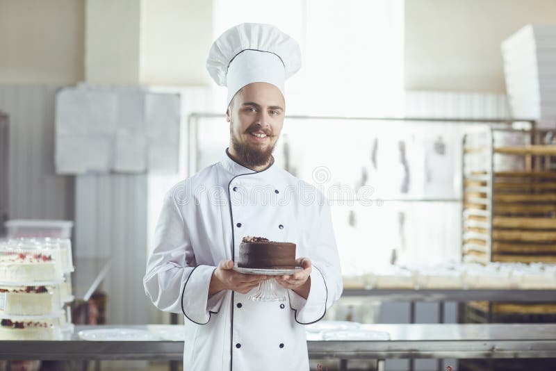 Confectioner Man Holding Cake Smiling in a Pastry Shop Stock Image ...