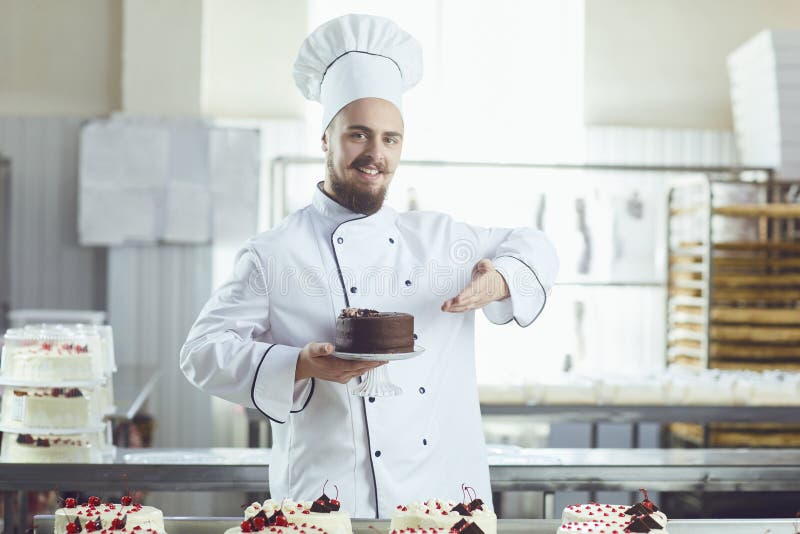 Confectioner Man Holding Cake Smiling in a Pastry Shop Stock Image ...