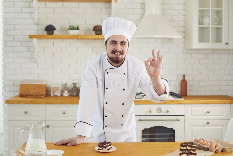Confectioner Man Smiles while Standing with Cake in His Hands at the ...
