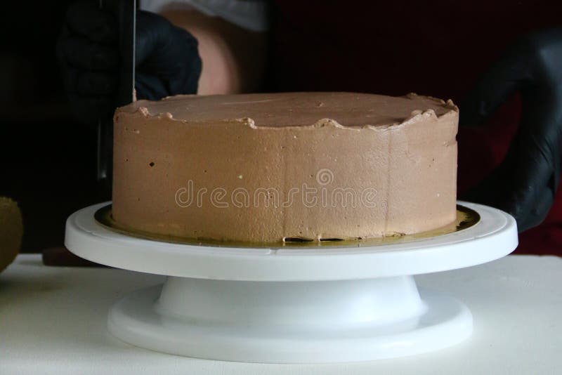 Confectioner Process Chocolate Cake on Table. the Process of Decorating ...